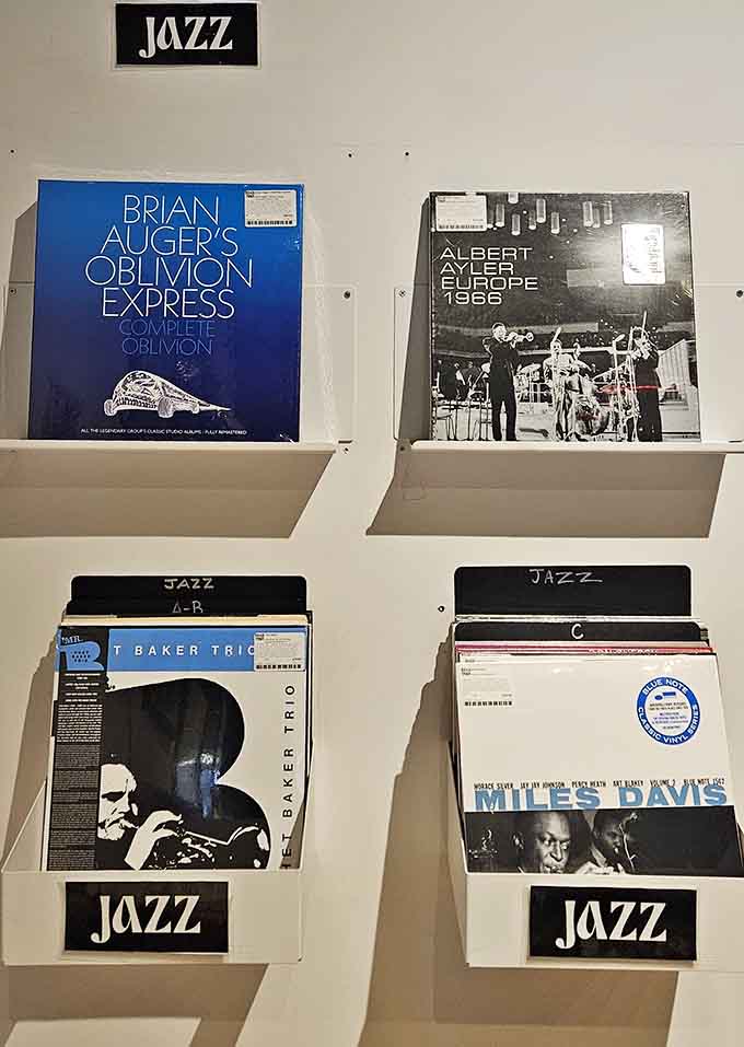 Jazz legends stare out from album covers, their timeless cool practically radiating through the protective plastic sleeves.