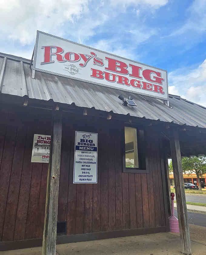 That sign has welcomed hungry travelers for generations, promising big burgers and delivering on every single word.
