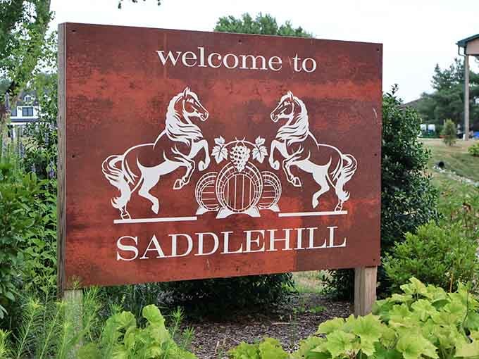 The welcome sign featuring rearing horses and wine barrels sets the tone before you even park&mdash;classy meets countryside in perfect harmony.