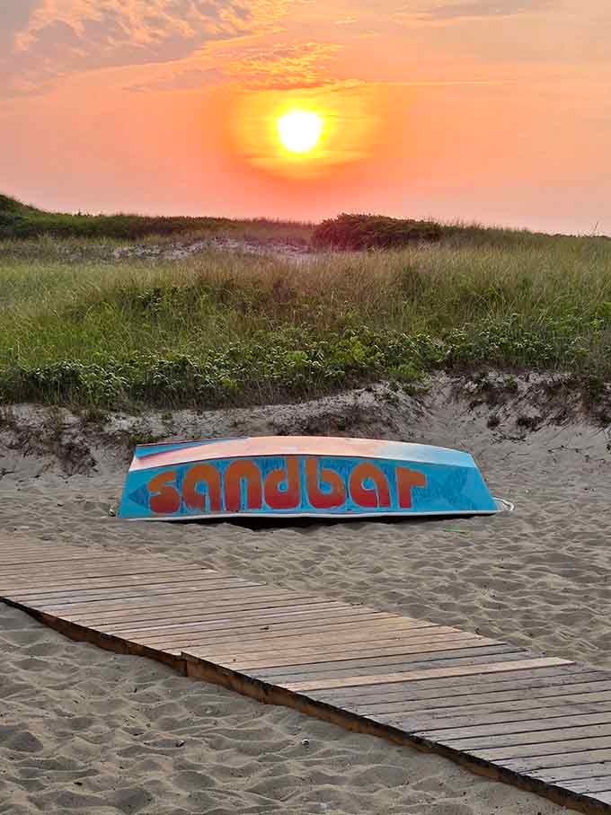 The Sandbar sign at golden hour, marking the spot where your perfect beach day becomes an unforgettable one.