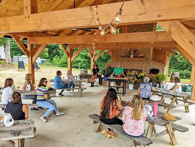 Workshop participants gather under the pavilion, transforming simple stems into arrangements worthy of any special occasion or Tuesday.