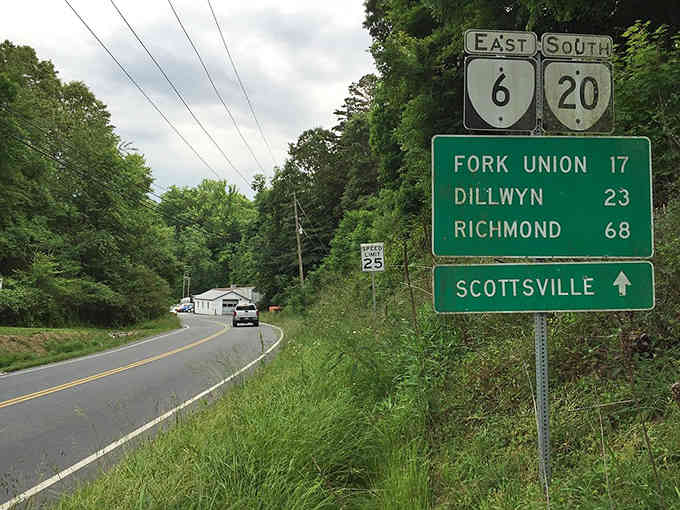 This road sign marks your escape route from the chaos, pointing toward a town that time forgot to ruin.