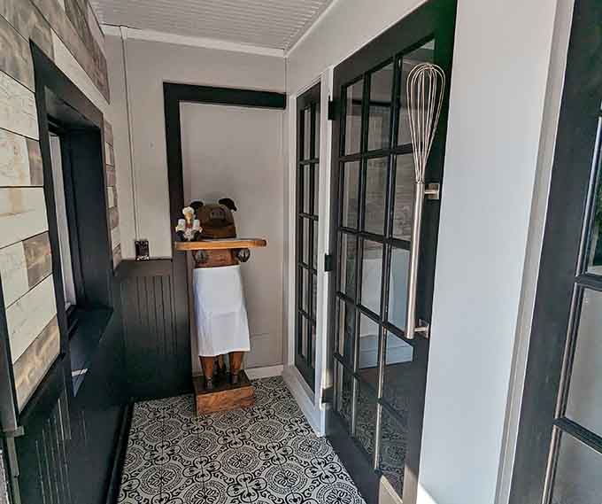 Charming entrance details with patterned tile and farmhouse touches prove that first impressions matter, especially when dinner's waiting inside.