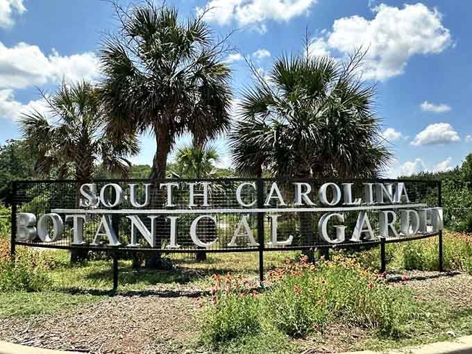 The entrance sign announces your arrival at 295 acres of botanical bliss, parking included free.