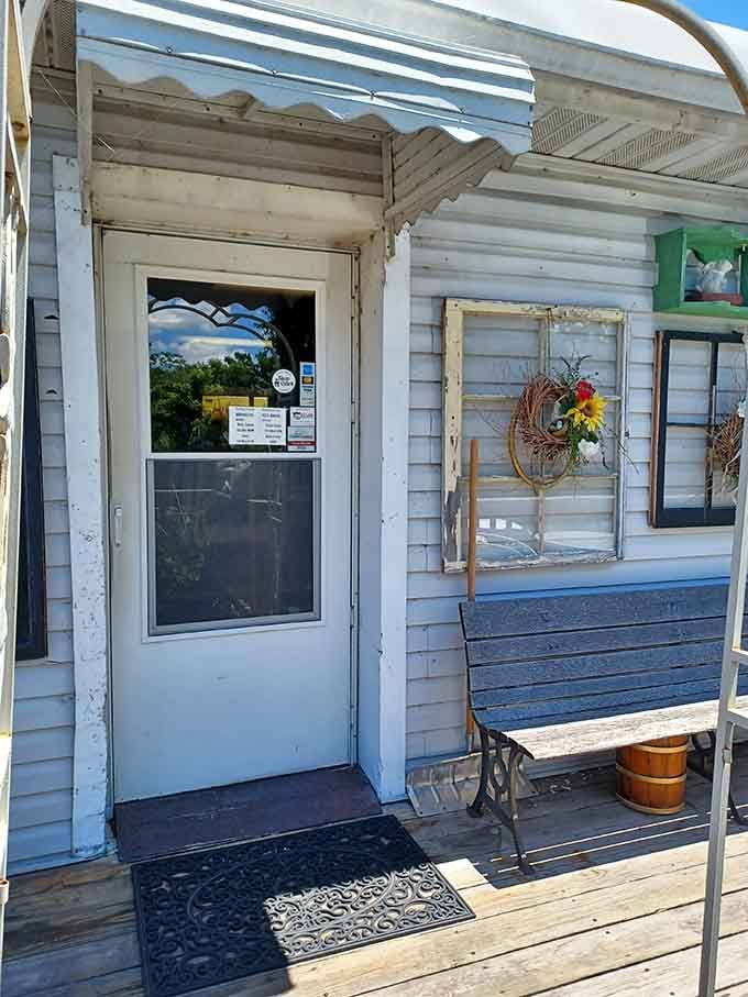 The entrance promises charm and delivers on that promise with homemade desserts waiting just beyond this welcoming door.