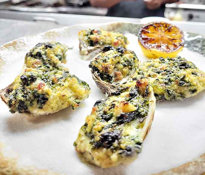 Oysters Rockefeller baked to bubbling perfection, because sometimes Kentucky does coastal cuisine better than the actual coast.