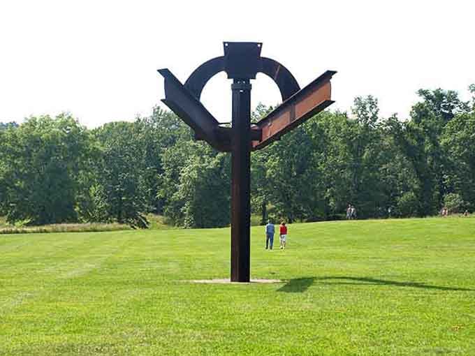 Dark metal branches spreading wide, like nature decided to collaborate with an industrial designer today.