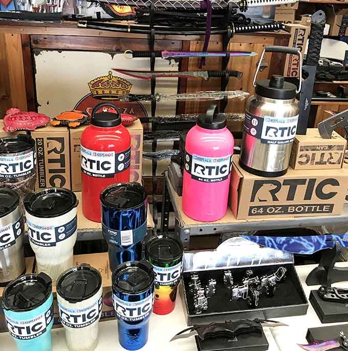 RTIC tumblers stand in rainbow formation, each insulated bottle promising to keep beverages perfectly chilled through Houston's legendary heat.