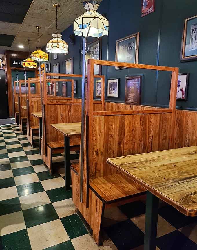 Wooden booth seating stretches invitingly across the dining room, ready to host your next memorable meal here.