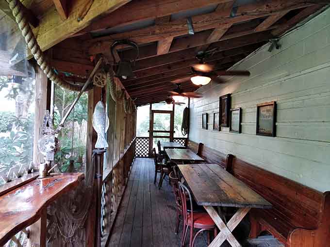 Porch dining with rustic charm and fishing nets overhead&mdash;eating seafood exactly where it belongs, near the water.