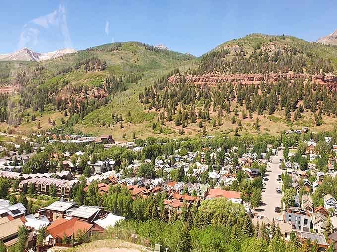 The valley spreads below in patchwork perfection, homes nestled among trees like nature's own subdivision.