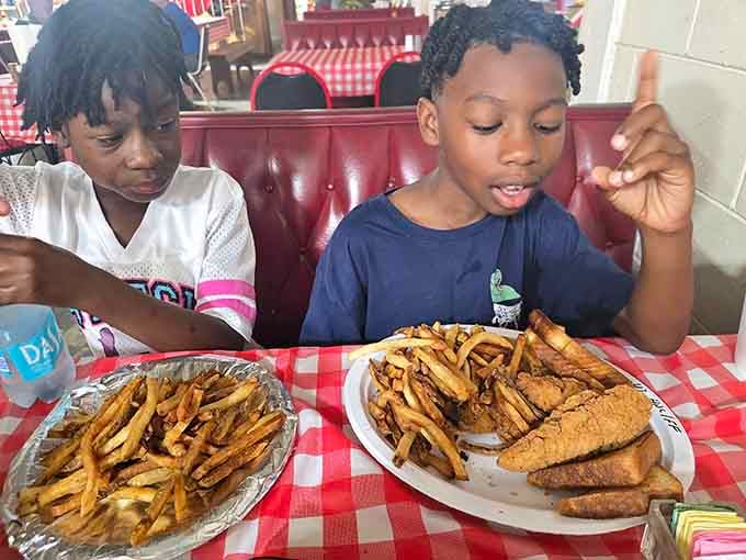 Young diners tackling their meals with the kind of enthusiasm that proves good food transcends all ages beautifully.