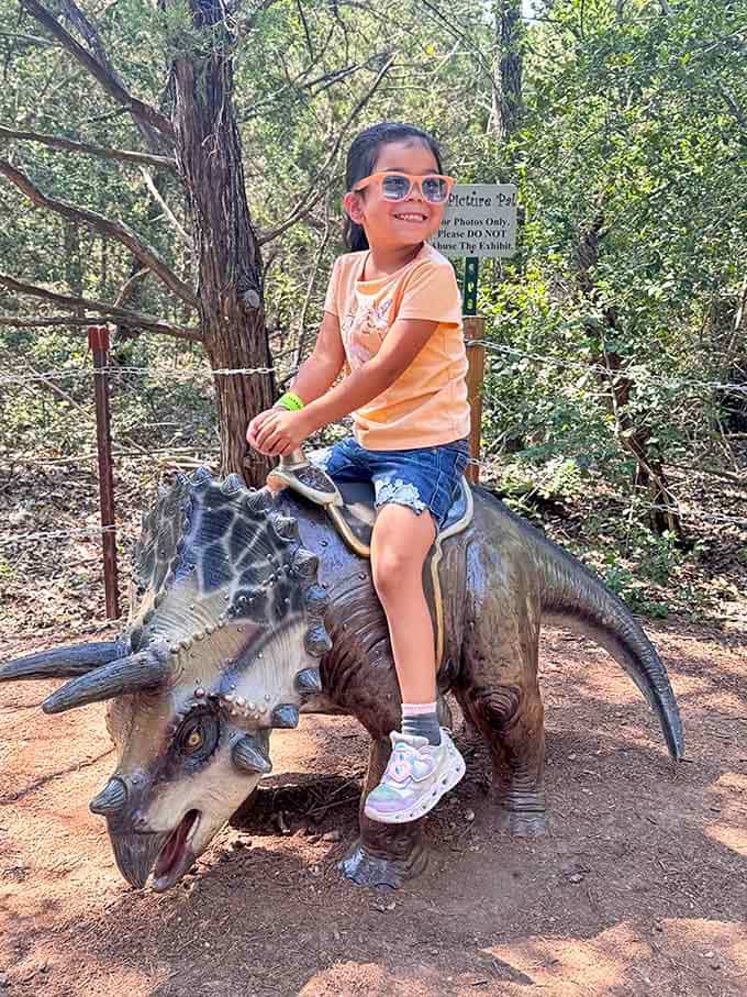 Riding a Triceratops beats a carousel horse any day, especially when you're grinning like you own it.