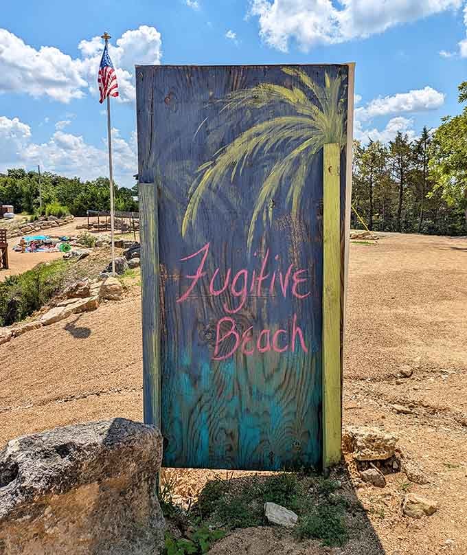The hand-painted welcome sign promises island vibes, and the view behind it absolutely delivers on that.