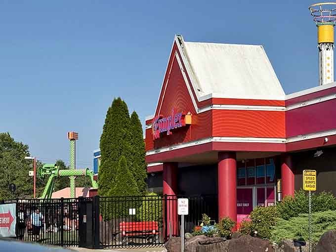 The bright red entrance welcomes families like a beacon of joy visible from the parking lot itself.