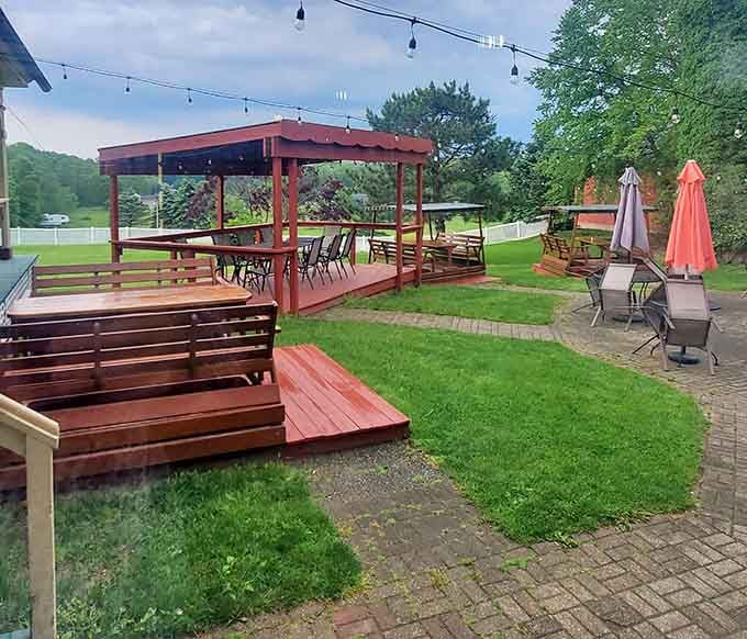 String lights and picnic tables overlooking green lawns transform ordinary meals into memorable moments worth savoring slowly together.