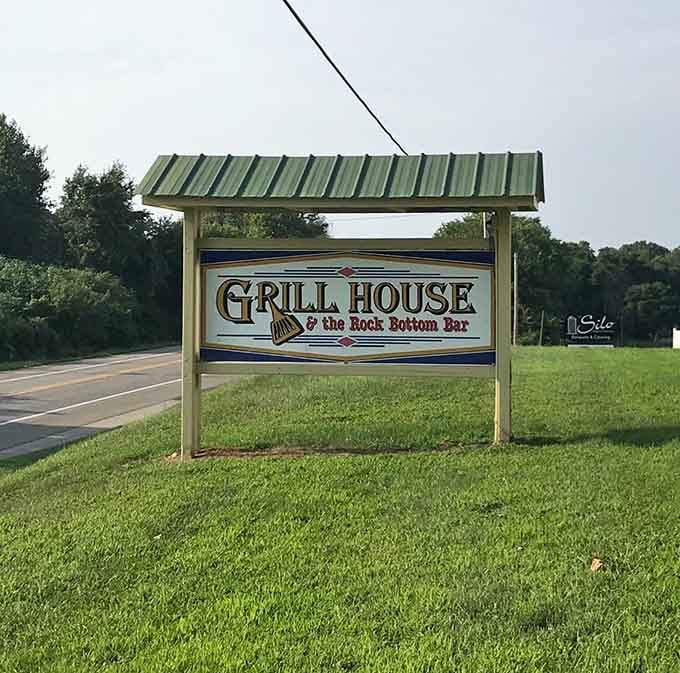 The roadside sign announces your destination with pride, because when you're this good, subtlety is overrated.