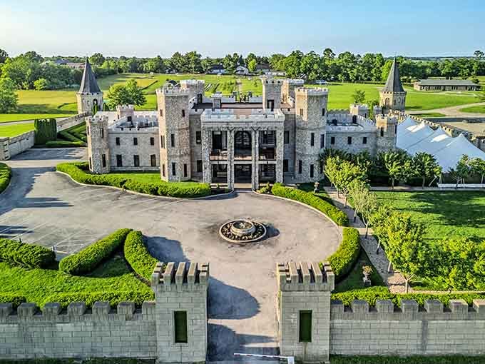 An aerial view revealing the full scope of this Kentucky marvel, turrets and all, sitting pretty in horse country.