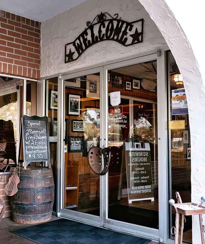 The welcoming entrance with a barrel planter and chalkboard specials invites you in like an old friend opening their front door.
