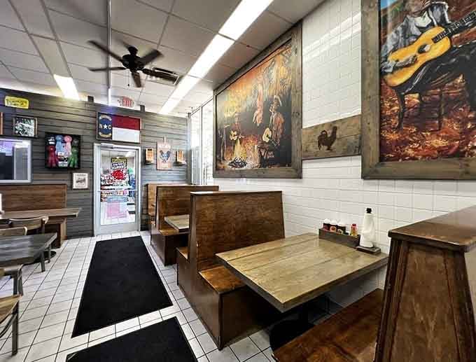 Booth seating with more barbecue imagery overhead, because subtlety has no place in a championship BBQ joint.