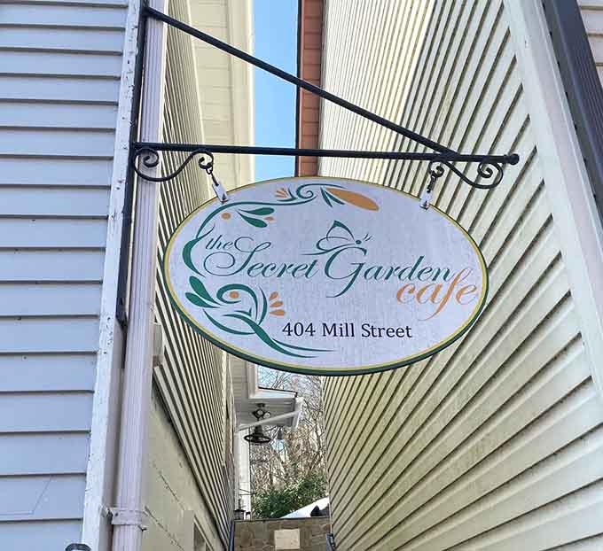 The Secret Garden Cafe's elegant sign welcomes hungry visitors to discover Occoquan's culinary treasure.