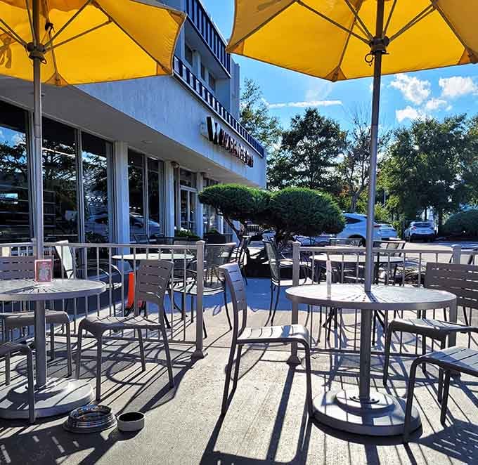 Sunny patio seating under bright yellow umbrellas offers the perfect spot for enjoying breakfast while soaking up Virginia sunshine.