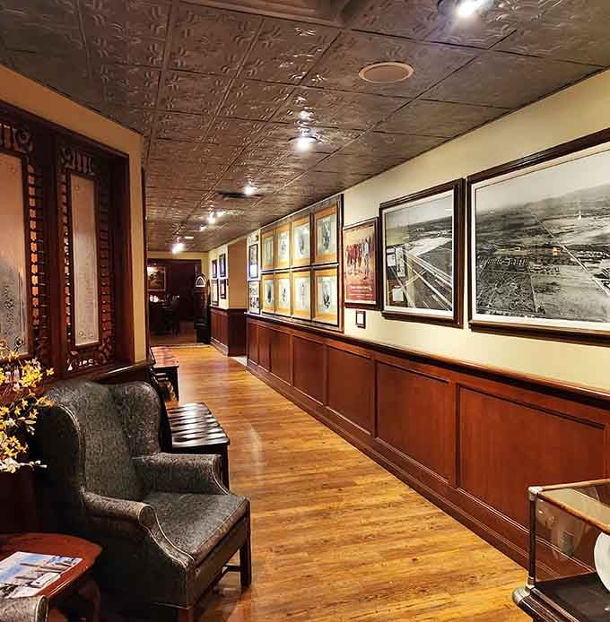 Historic photographs lining the hallway tell stories of Arizona's cattle industry, connecting past traditions to present-day dining excellence.