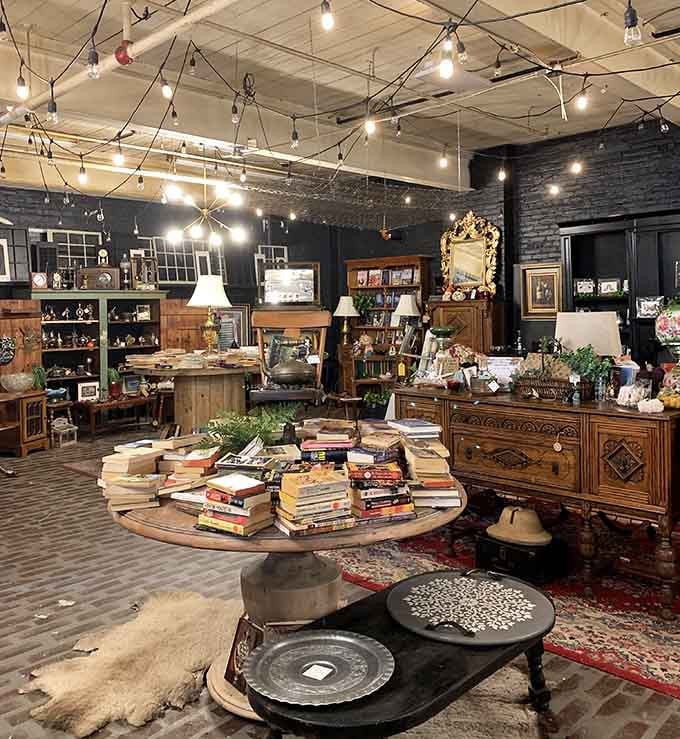 The full view reveals an expansive space where industrial chic meets cozy treasure hunting perfection.