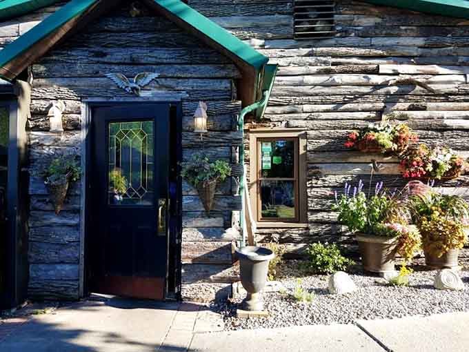 The entrance welcomes you with flowers and charm, promising good things await just beyond that door.