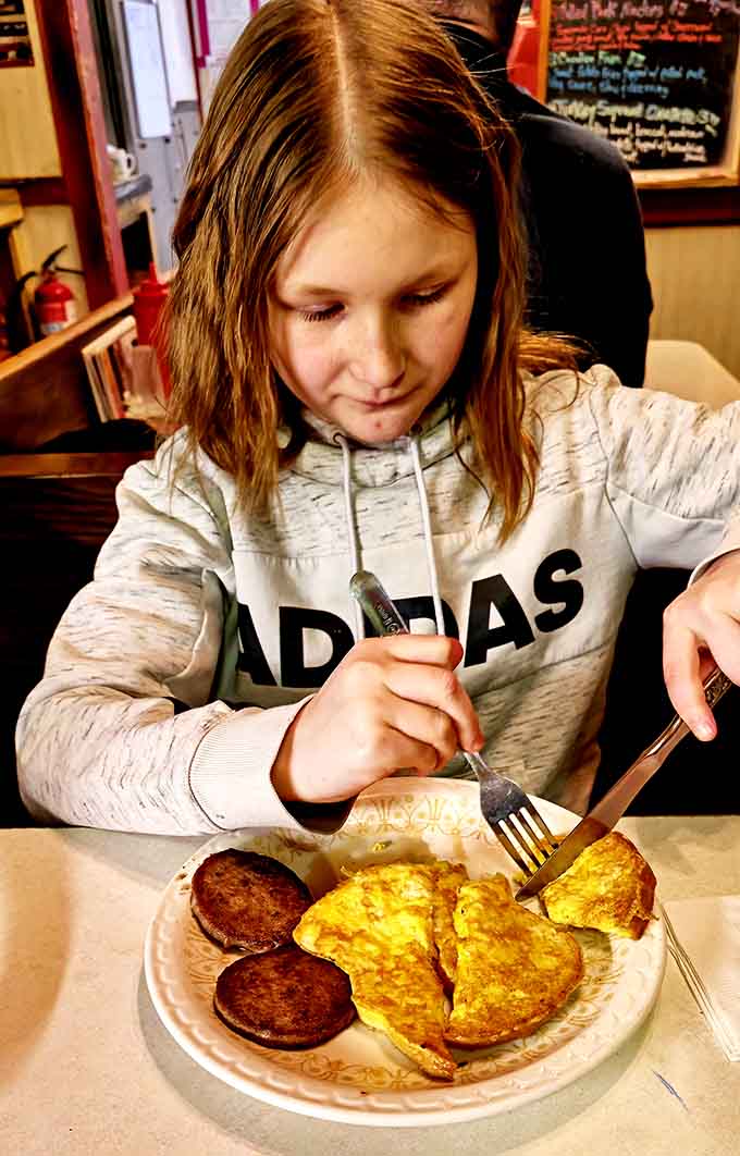 Young diners tackle their breakfast with the kind of focus these generous portions truly deserve here.