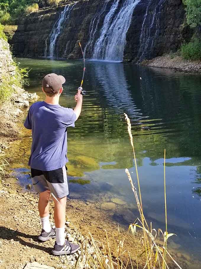 Casting a line with a waterfall backdrop, because some folks know the secret to combining relaxation with spectacular scenery.