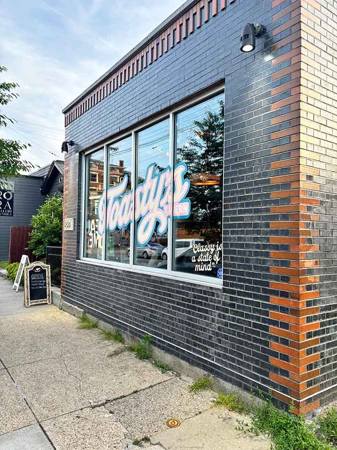 The window signage declaring "Classy is a state of mind" in flowing script, basically the restaurant's entire philosophy in neon.