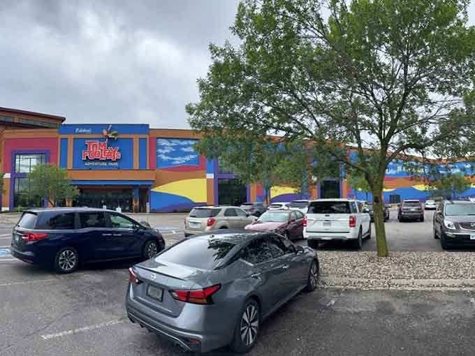 The parking lot view shows the colorful fortress where Wisconsin families escape when Mother Nature throws her seasonal tantrums.