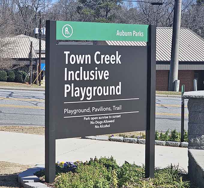 The sign says it all: Town Creek Inclusive Playground, where every child belongs and plays together.