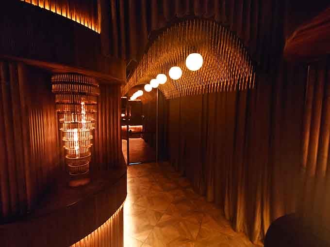 The entrance hallway glows with warm light, leading you deeper into this hidden world where time moves differently.