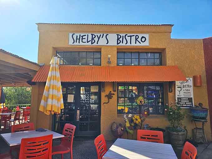 Cheerful orange chairs and striped umbrellas promise fresh seasonal cuisine worth the scenic drive south.