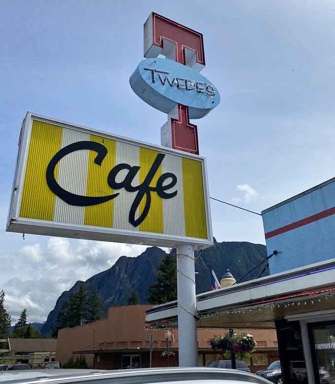 The vintage sign stands tall like a beacon calling hungry travelers to breakfast paradise in the mountains.