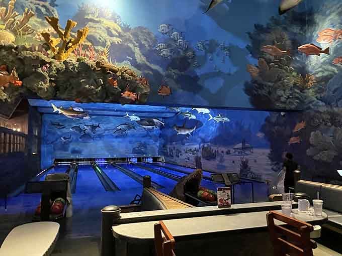 Those bowling lanes glow blue like you're rolling strikes at the bottom of the ocean itself.