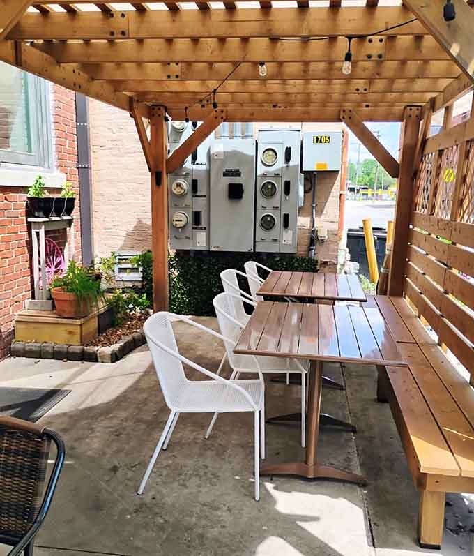 The outdoor patio offers fresh air dining with quirky industrial art, because why not add character outside too.