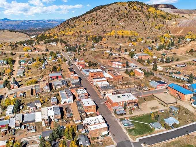 From above, Victor nestles in its mountain bowl like a secret kept in plain sight, autumn aspens gilding the edges.