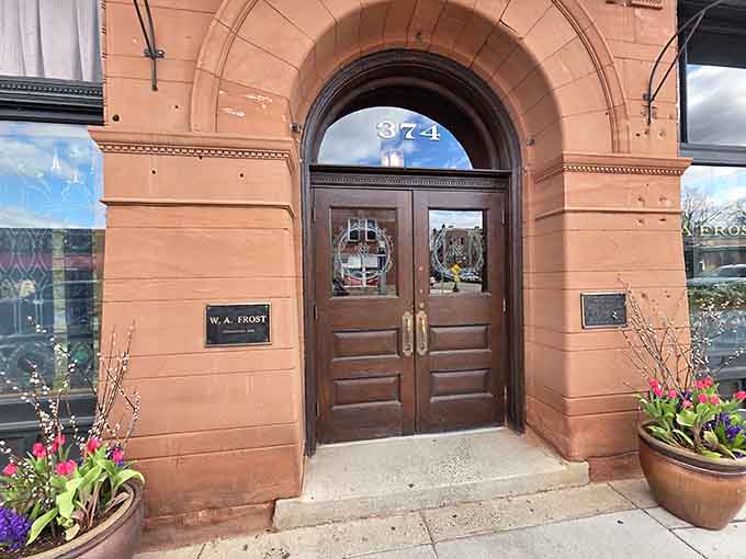 Those welcoming wooden doors flanked by spring flowers are basically saying "come in, we've been expecting you" in the nicest way possible.