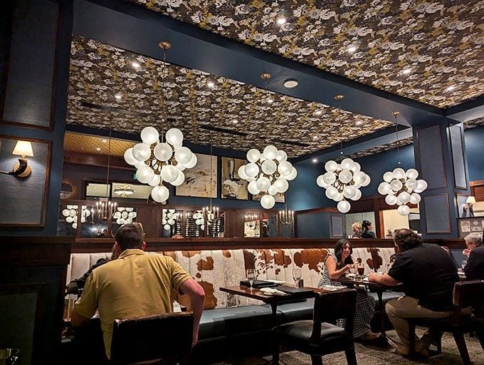 Cozy booths and warm lighting create the perfect setting for conversations that linger long after dessert.