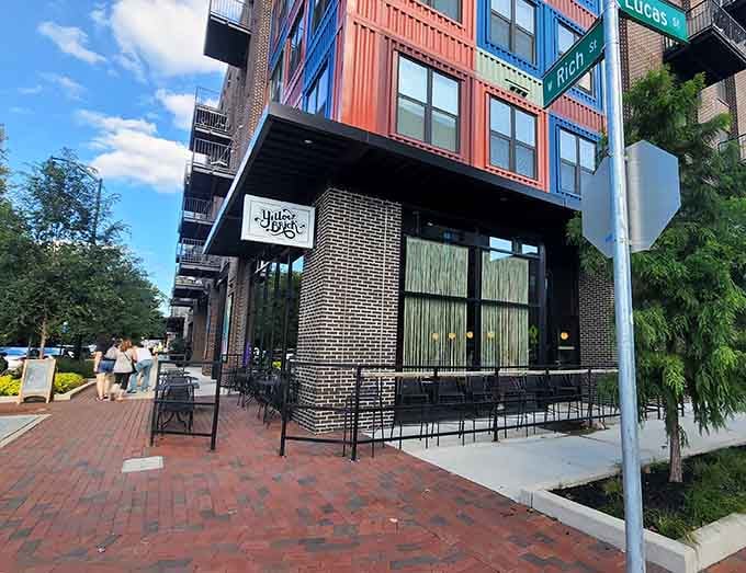 The storefront sits perfectly in this urban neighborhood, beckoning passersby to discover what's cooking inside those walls.