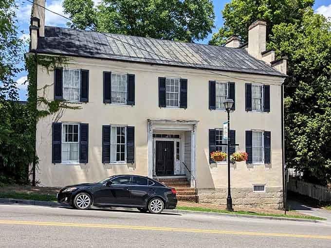 This elegant colonial building with black shutters has witnessed more dinner conversations than your favorite family gathering spot.