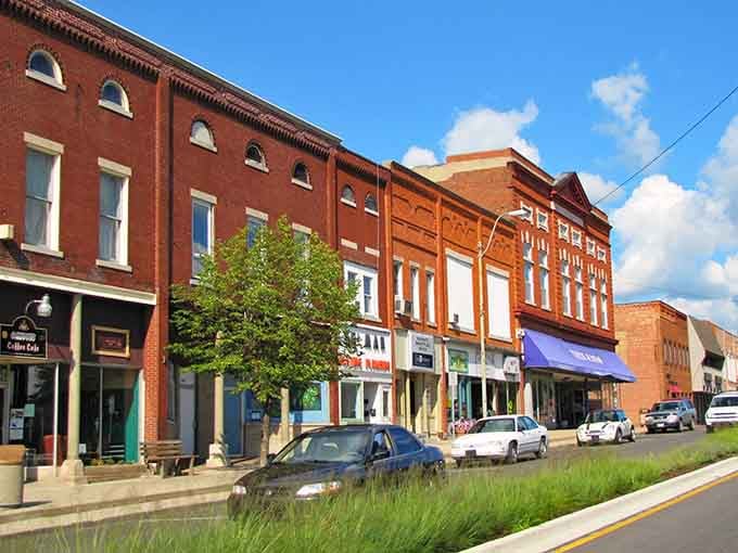 Those red brick storefronts under blue skies prove small-town charm never goes out of style, does it?