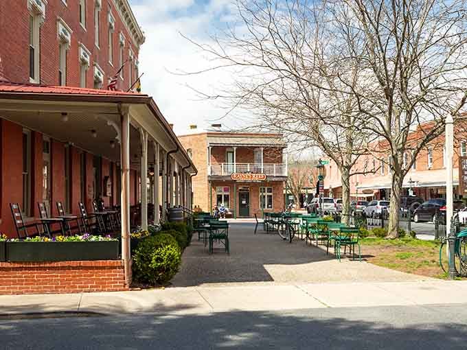 Those cheerful green chairs practically beg you to sit down with coffee and watch small-town life unfold.