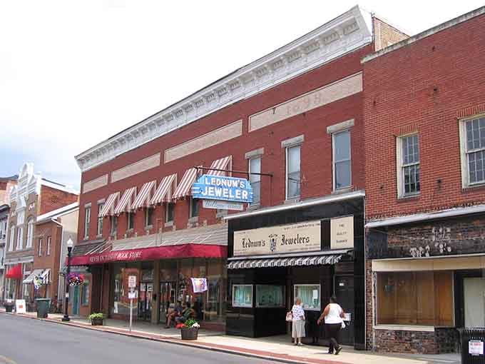 Classic storefronts with striped awnings line Cambridge's historic downtown, where every brick tells a century-old story.