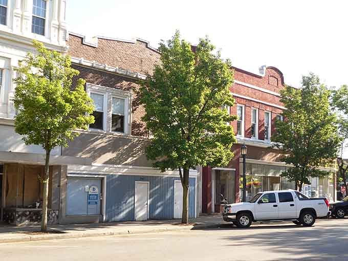 Sunlight filters through downtown trees where brick storefronts stand ready to welcome you home without breaking the bank.