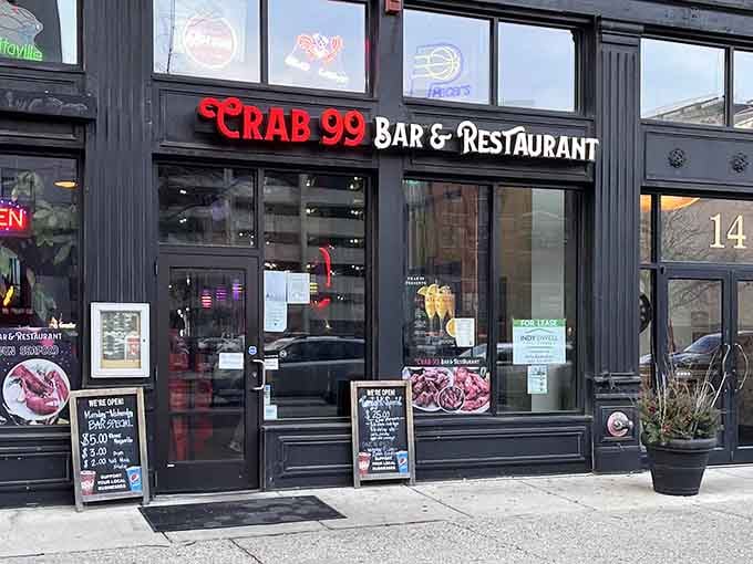 That bold red neon sign against sleek black storefront practically screams "fresh crab inside" to downtown Indianapolis passersby.