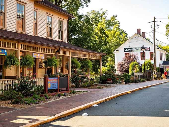 Golden afternoon light bathes these historic storefronts where brick sidewalks invite leisurely strolls through mountain charm.